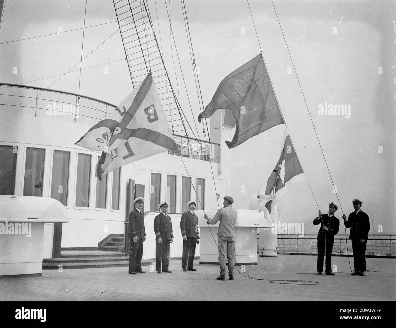 Queen Mary , handed over to Cunard White Star at Southampton , flies ...