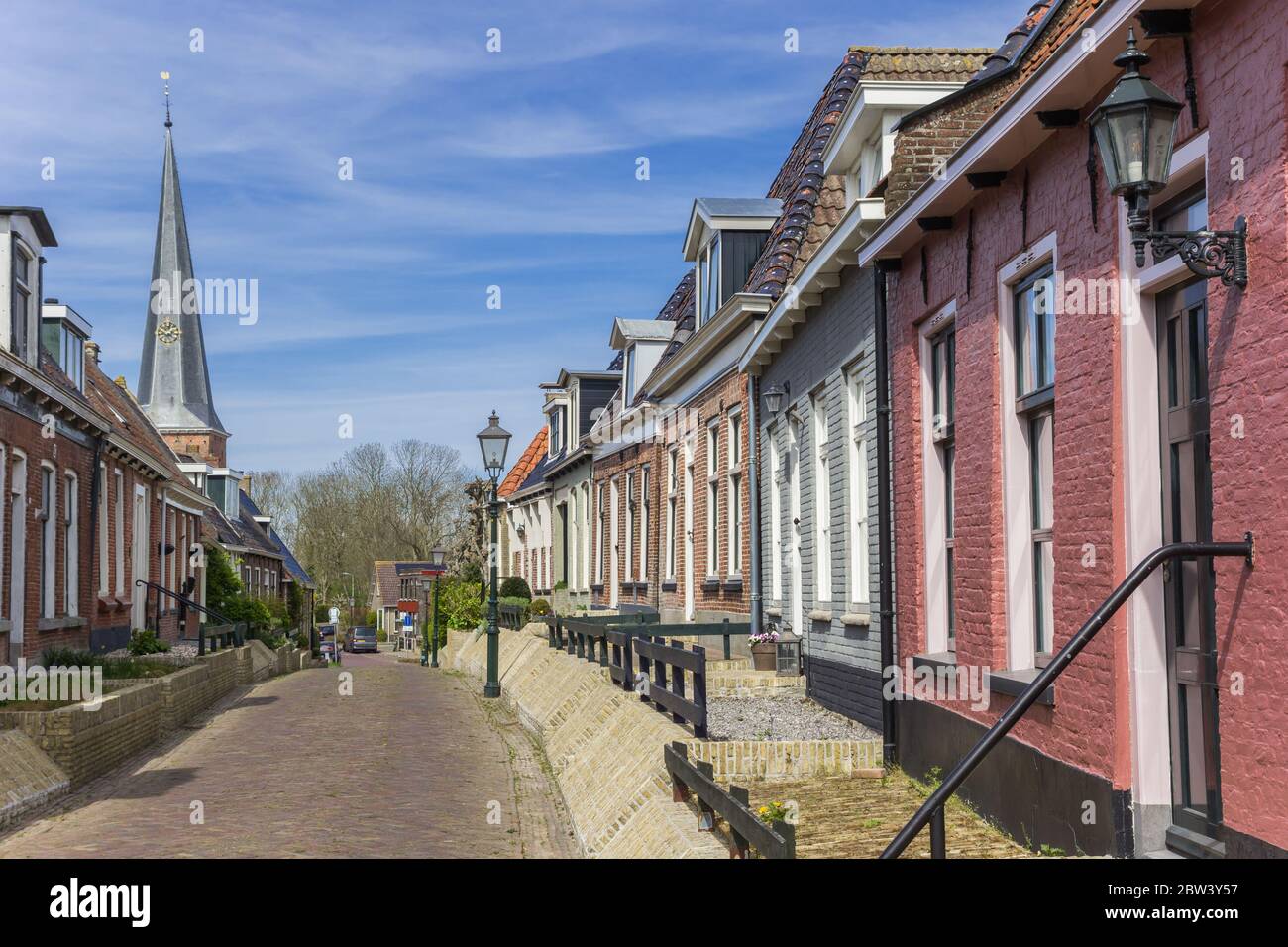 Colorful traditional houses in the small village Holwerd, Netherlands ...