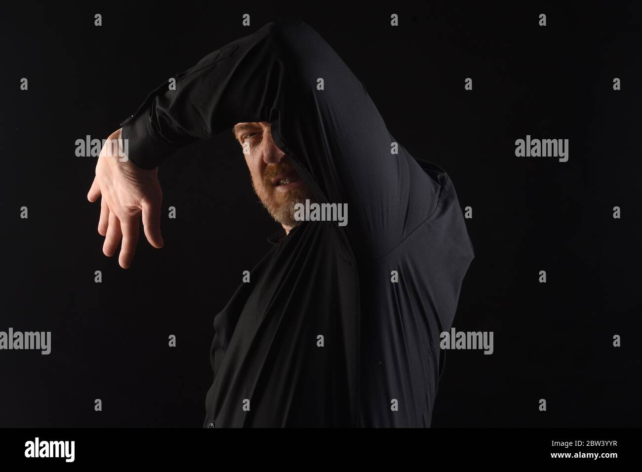 man raising his arm to protect himself Stock Photo - Alamy