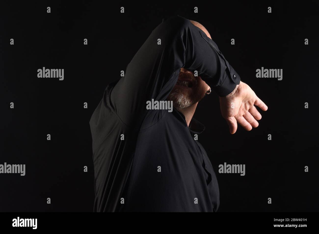 man raising his arm to protect himself Stock Photo - Alamy