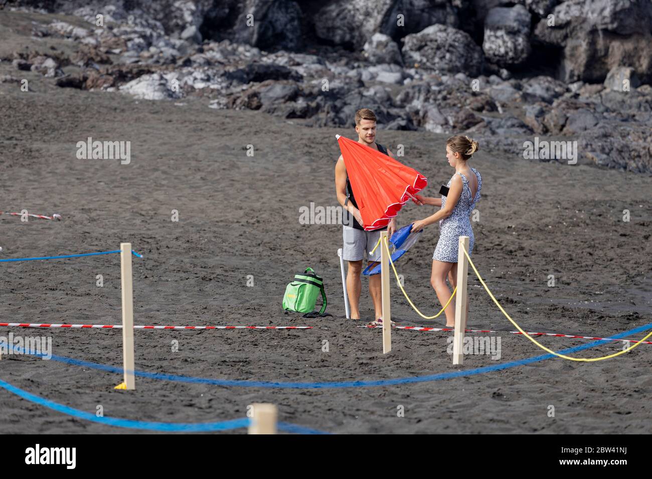 People arriving on the beach to sunbathe and swim during phase two de ...