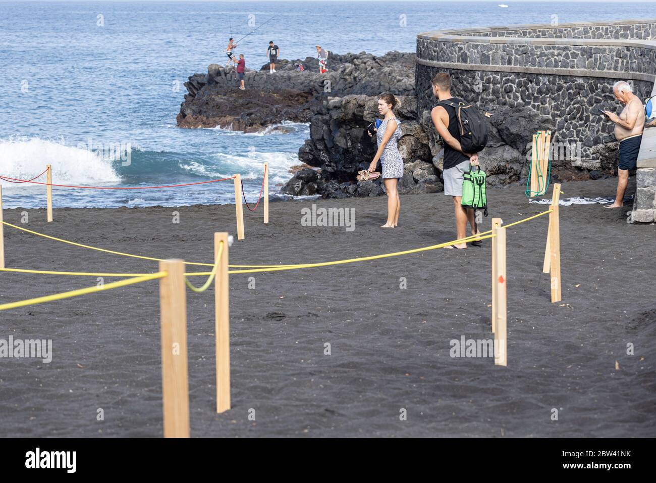 People arriving on the beach to sunbathe and swim during phase two de ...