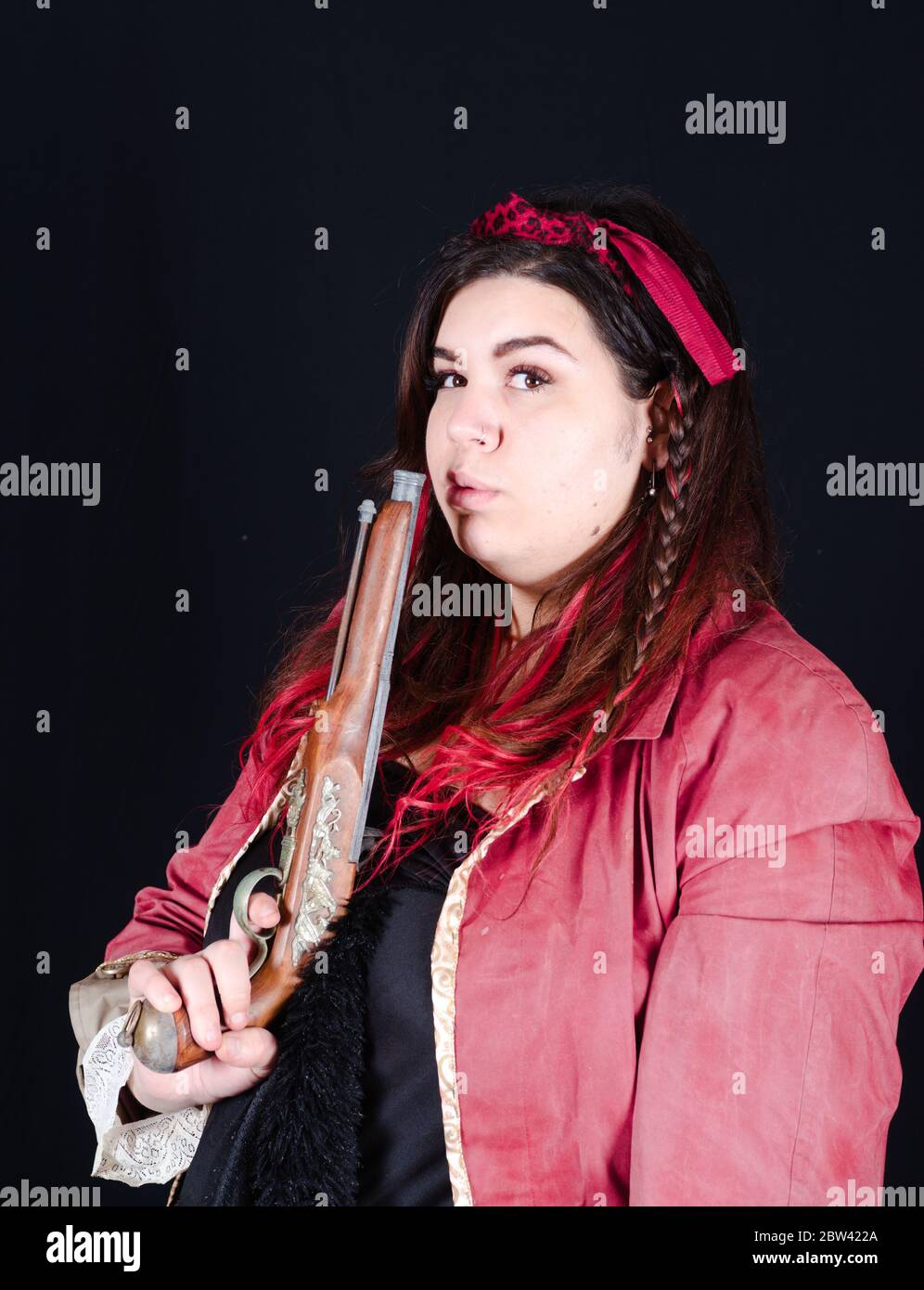 pirate girl with red jacket on the black background Stock Photo - Alamy
