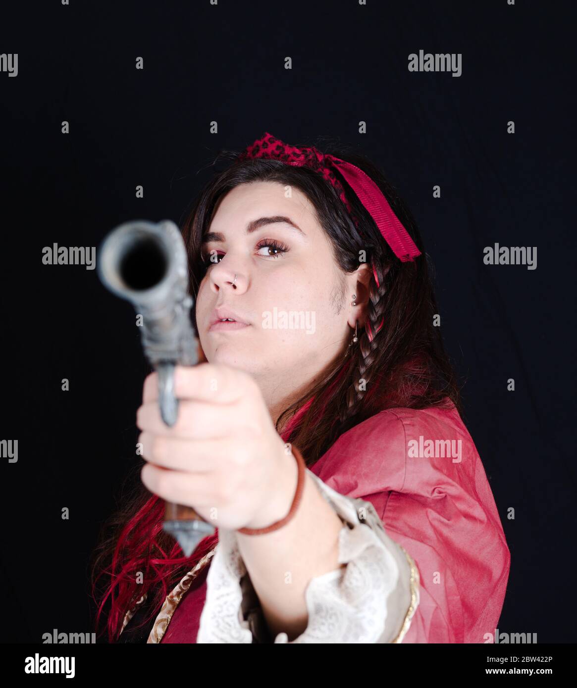 pirate girl with red jacket on the black background Stock Photo - Alamy
