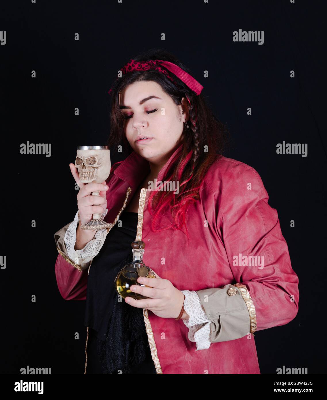 pirate girl with red jacket on the black background Stock Photo - Alamy