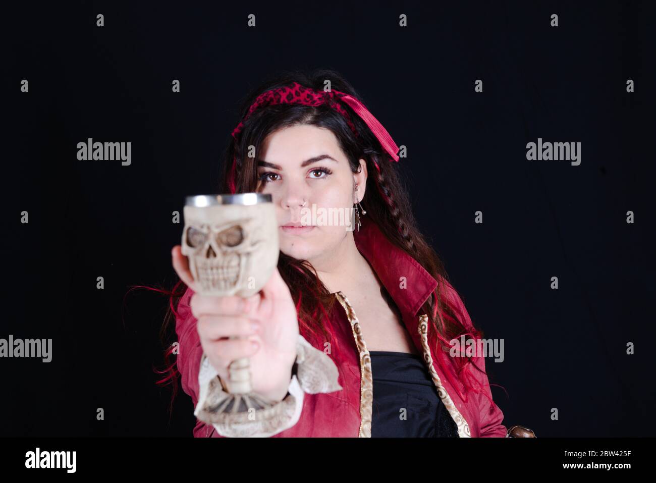 pirate girl with red jacket on the black background Stock Photo - Alamy