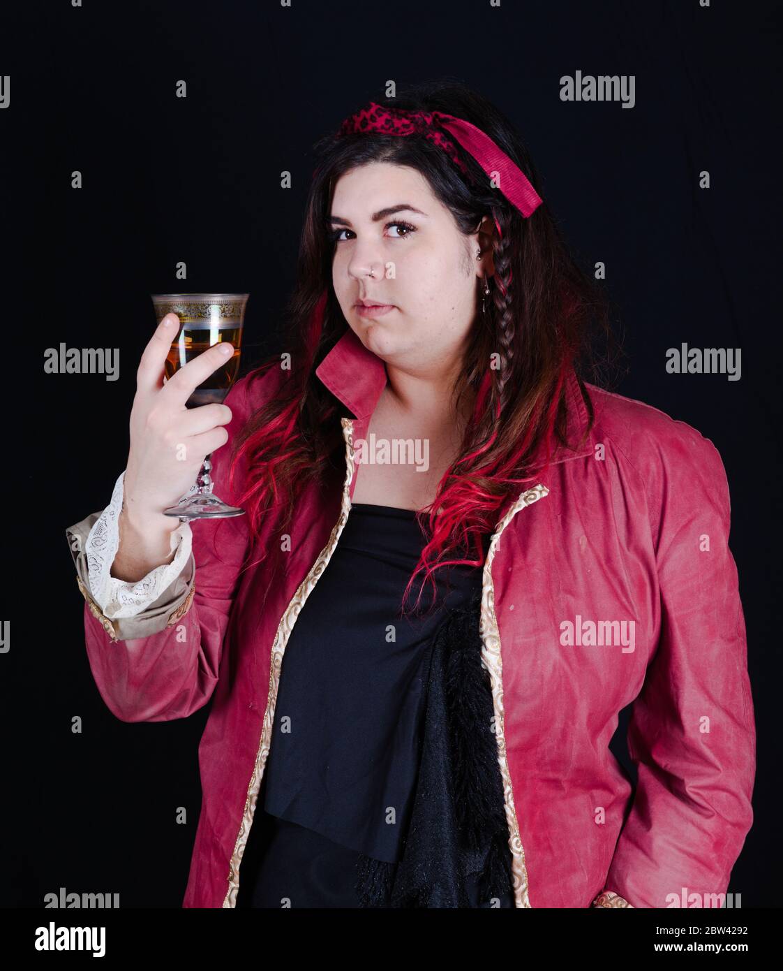 pirate girl with red jacket on the black background Stock Photo - Alamy