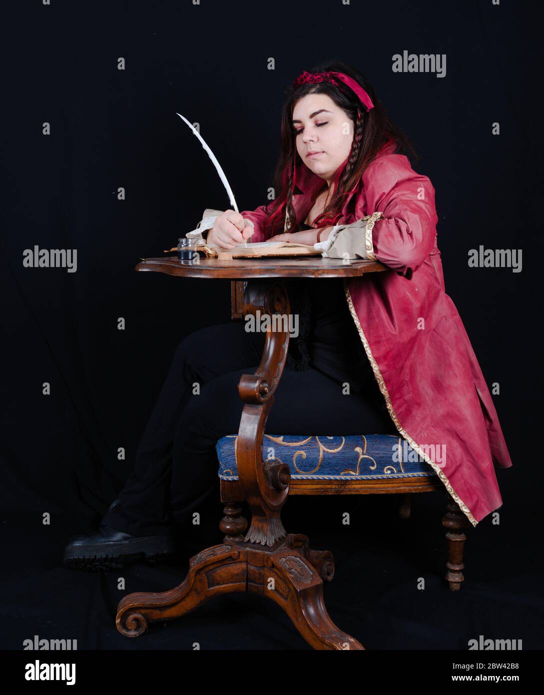 pirate girl with red jacket on the black background Stock Photo - Alamy