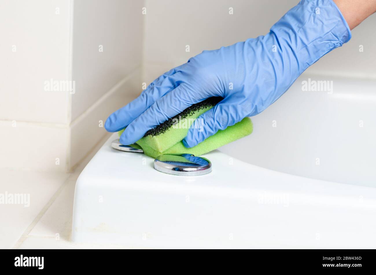 Close-up hand of maid cleaning and disinfectant bathroom Stock Photo ...