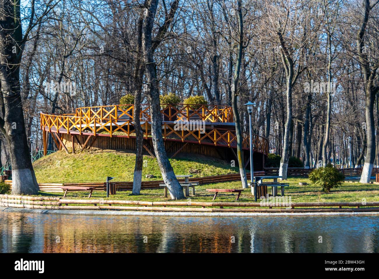The recreational lake in the Roman park reflecting the colors of autumn ...