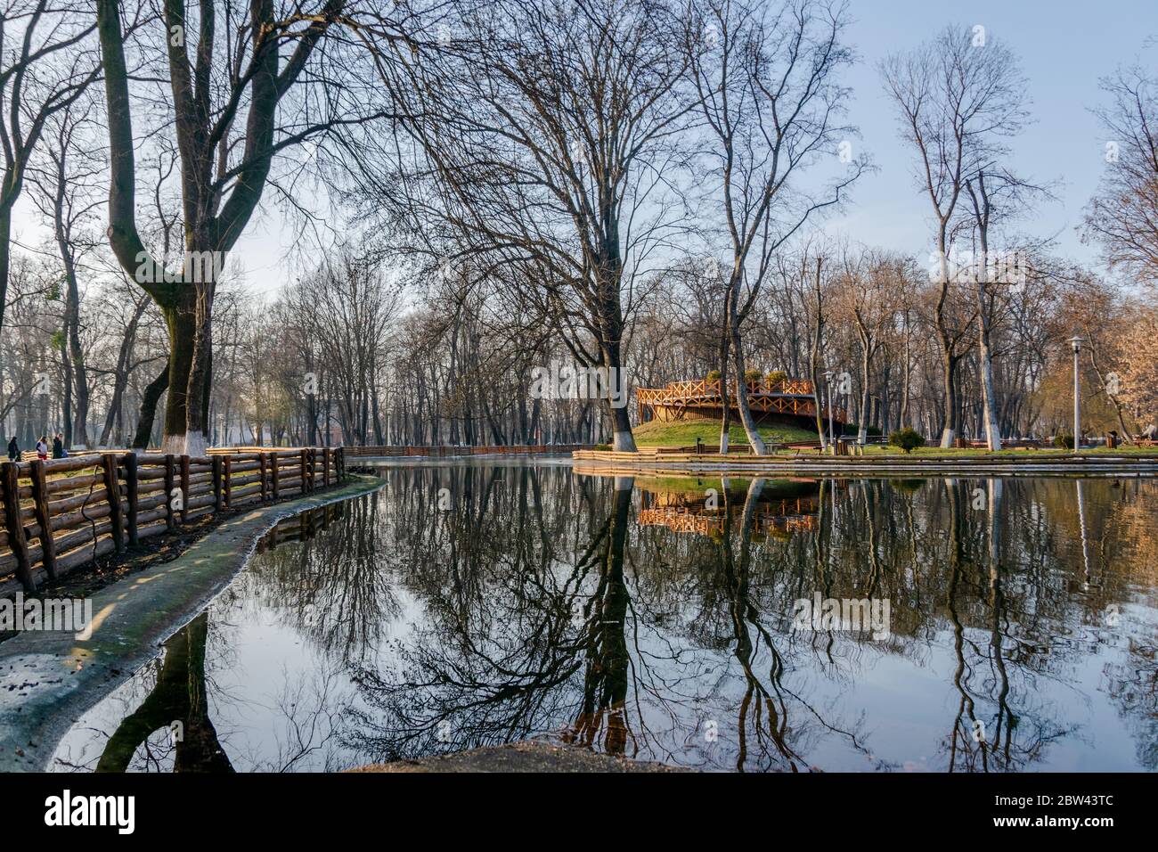 The recreational lake in the Roman park reflecting the colors of autumn ...