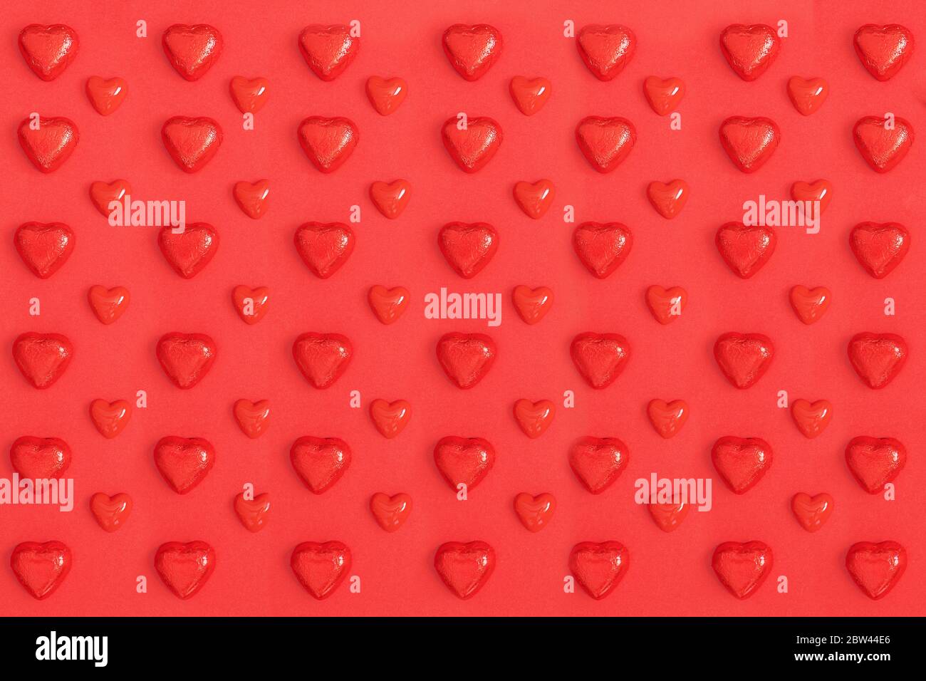 Red heart pattern on red background. Monochromatic effect Stock Photo ...