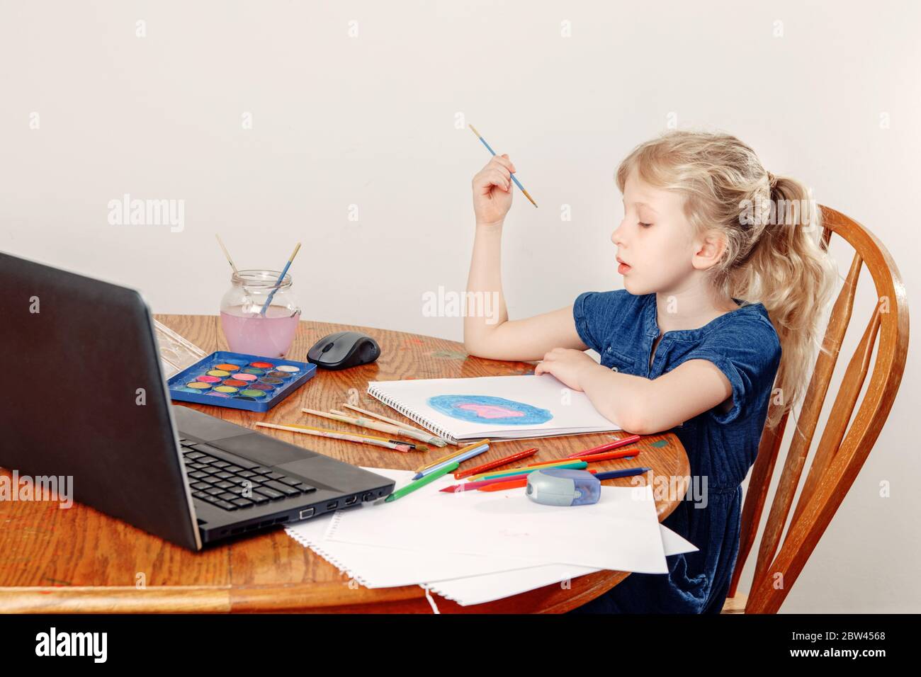 Girl child learning art lesson online on laptop Internet. Virtual ...