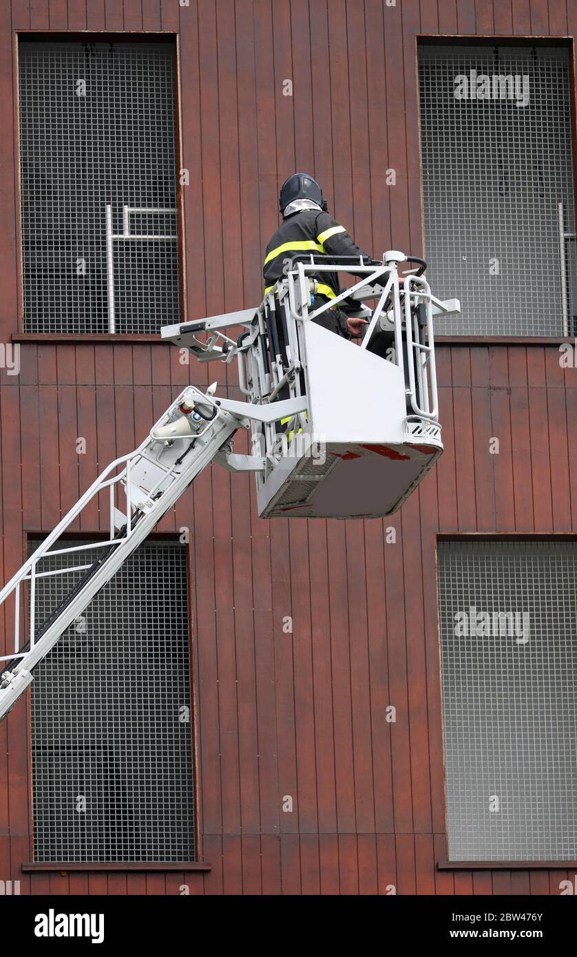 firefighter on the aerial platform during practice Stock Photo - Alamy
