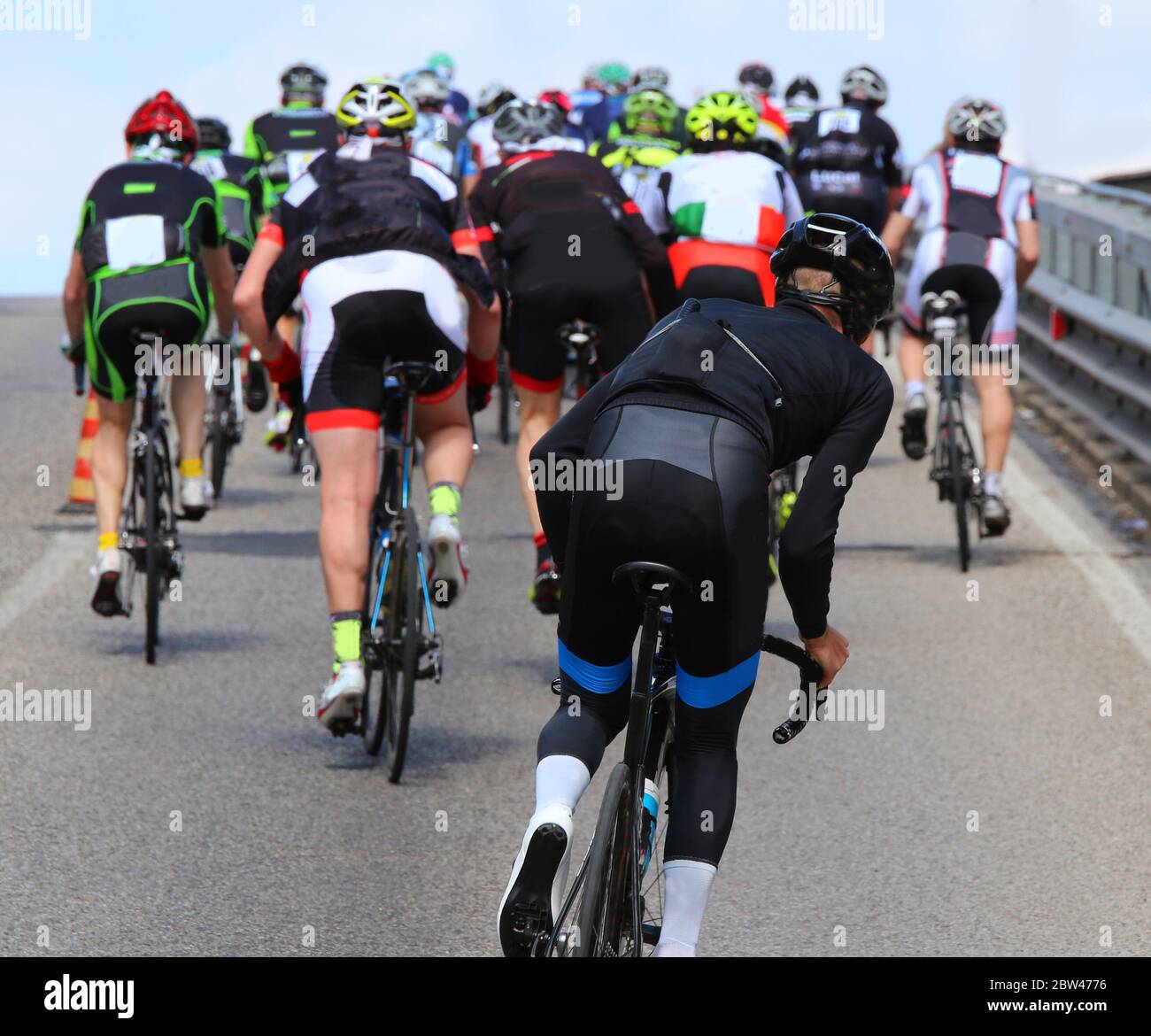 groups of many professional cyclists in the race in the city with the ...