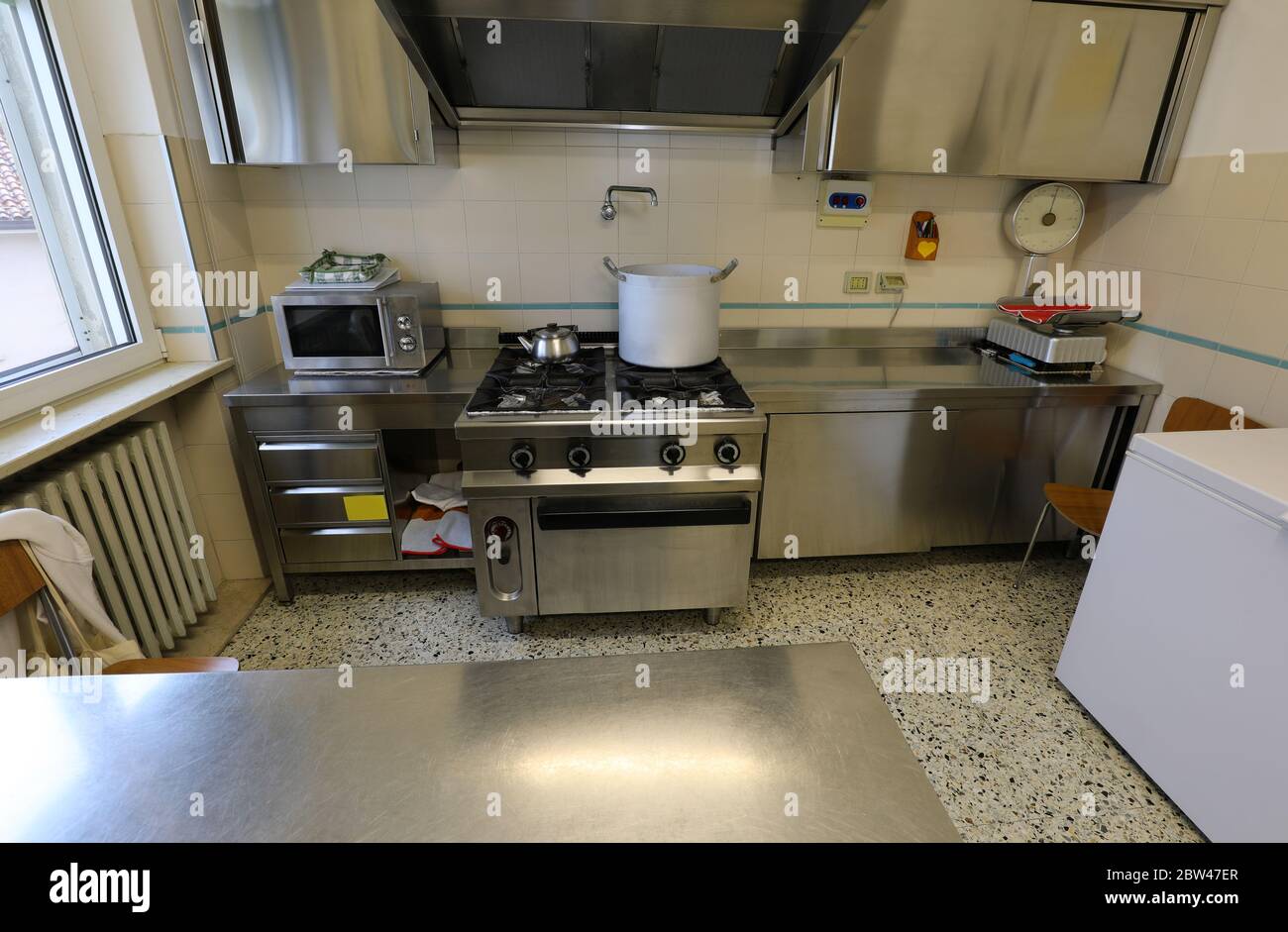 interior of an equipped industrial kitchen without the cooks with stove ...