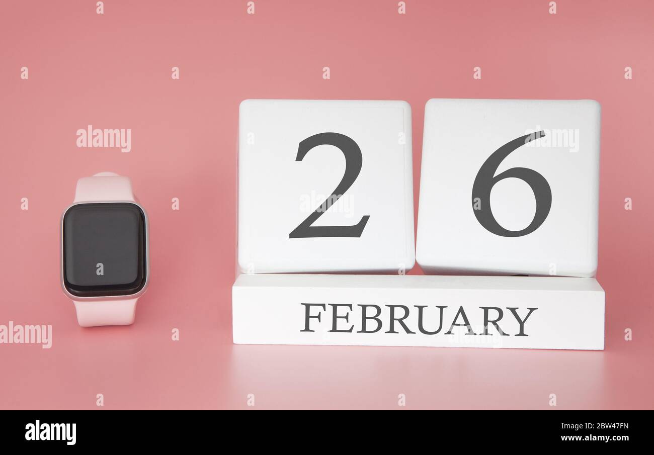 Modern Watch with cube calendar and date 26 february on pink background ...