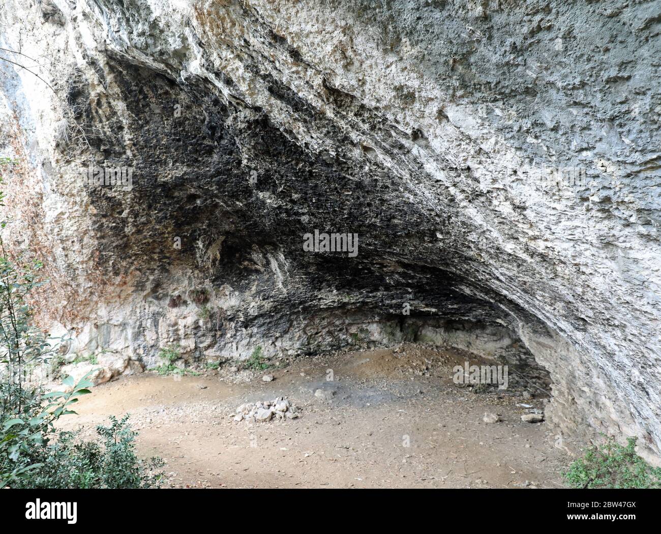 interior of an ancient cave carved into the rock of the mountain that ...