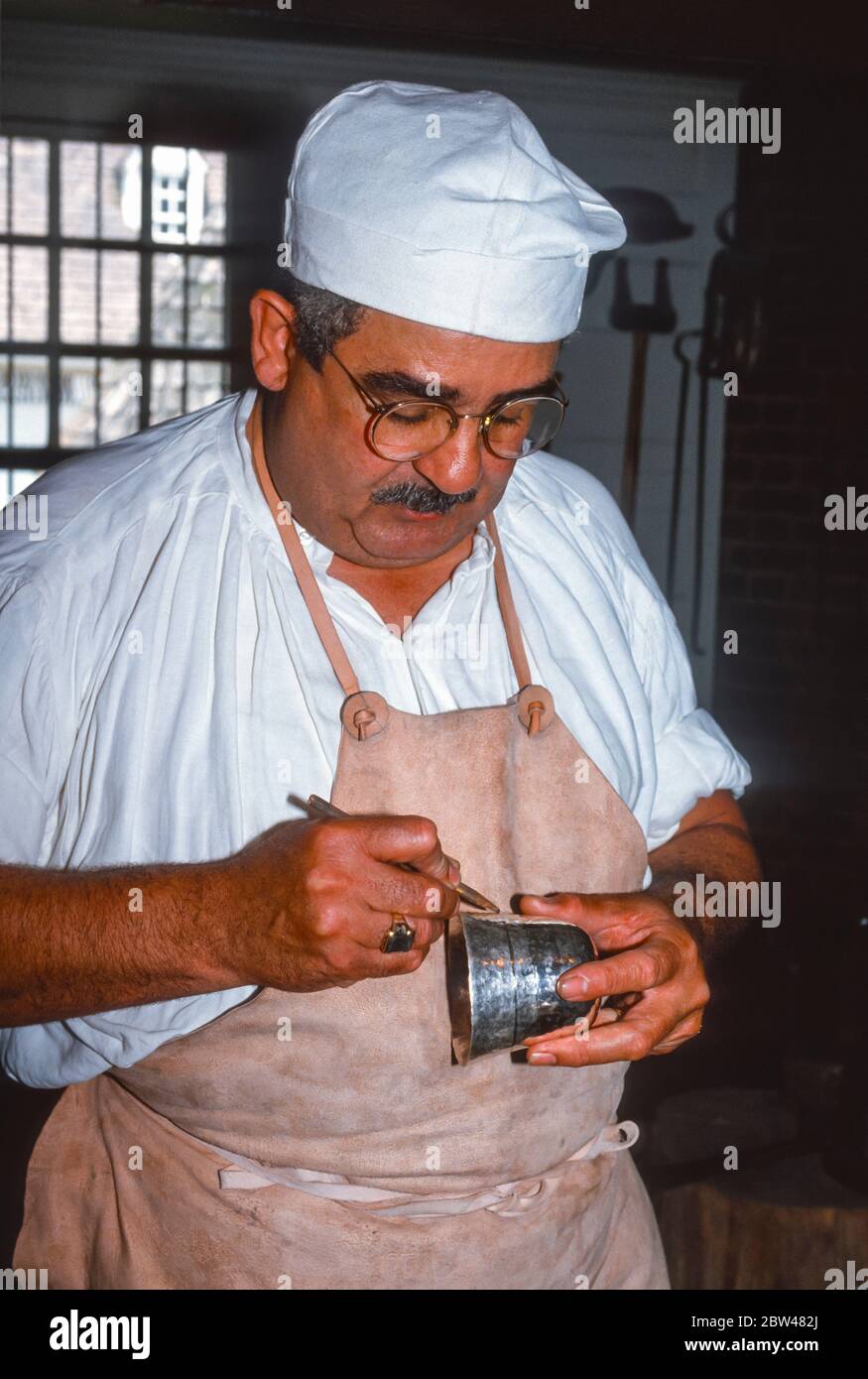WILLIAMSBURG, VIRGINIA, USA, MAY 1993 - Silversmith at Colonial ...