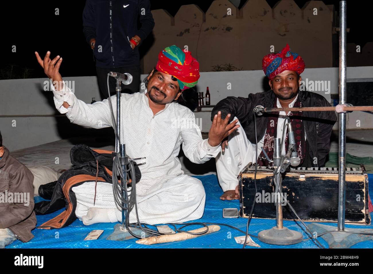 A Male artists performing with indian musical instruments in thar ...