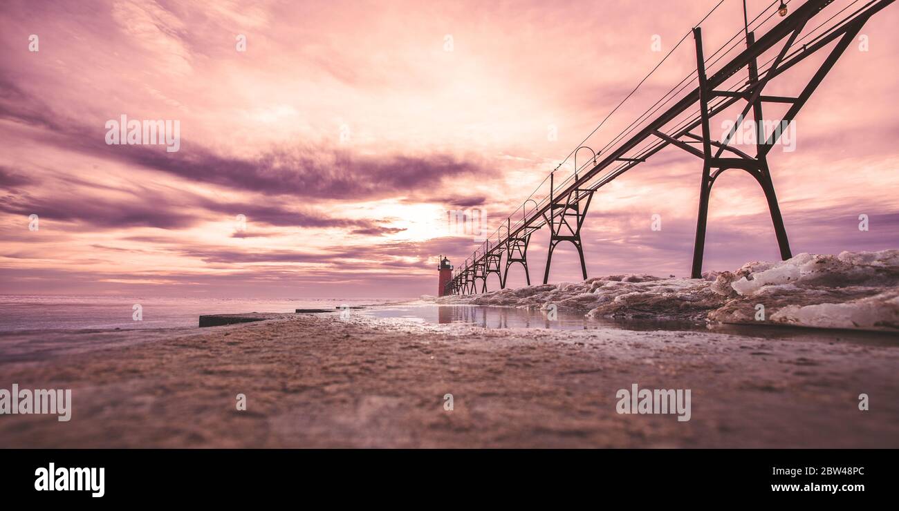 Red Lighthouse During the Pink and Purple Sunset in the Winter at a Low ...