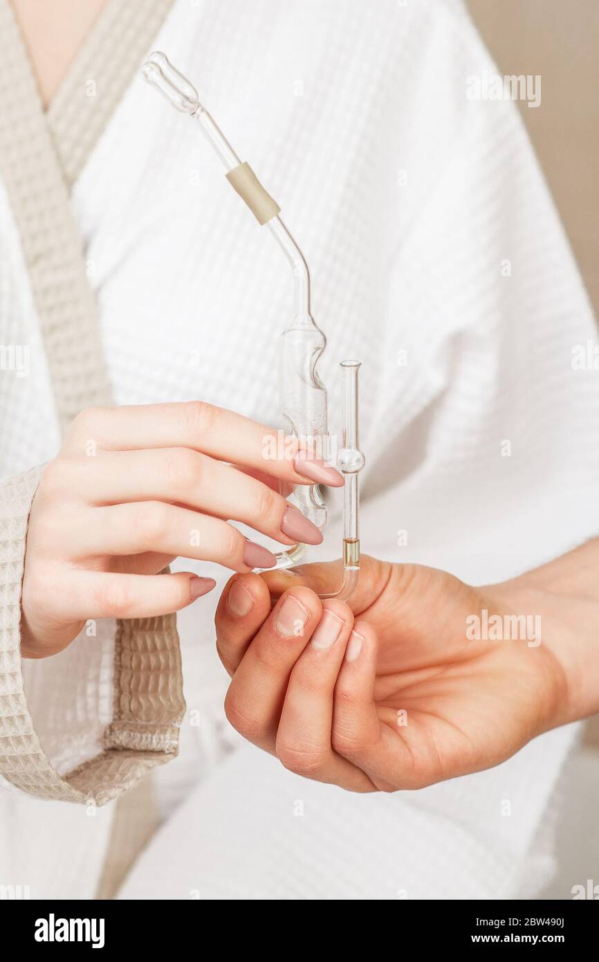 Nasal oil inhaler Maholda in hands close up Stock Photo - Alamy