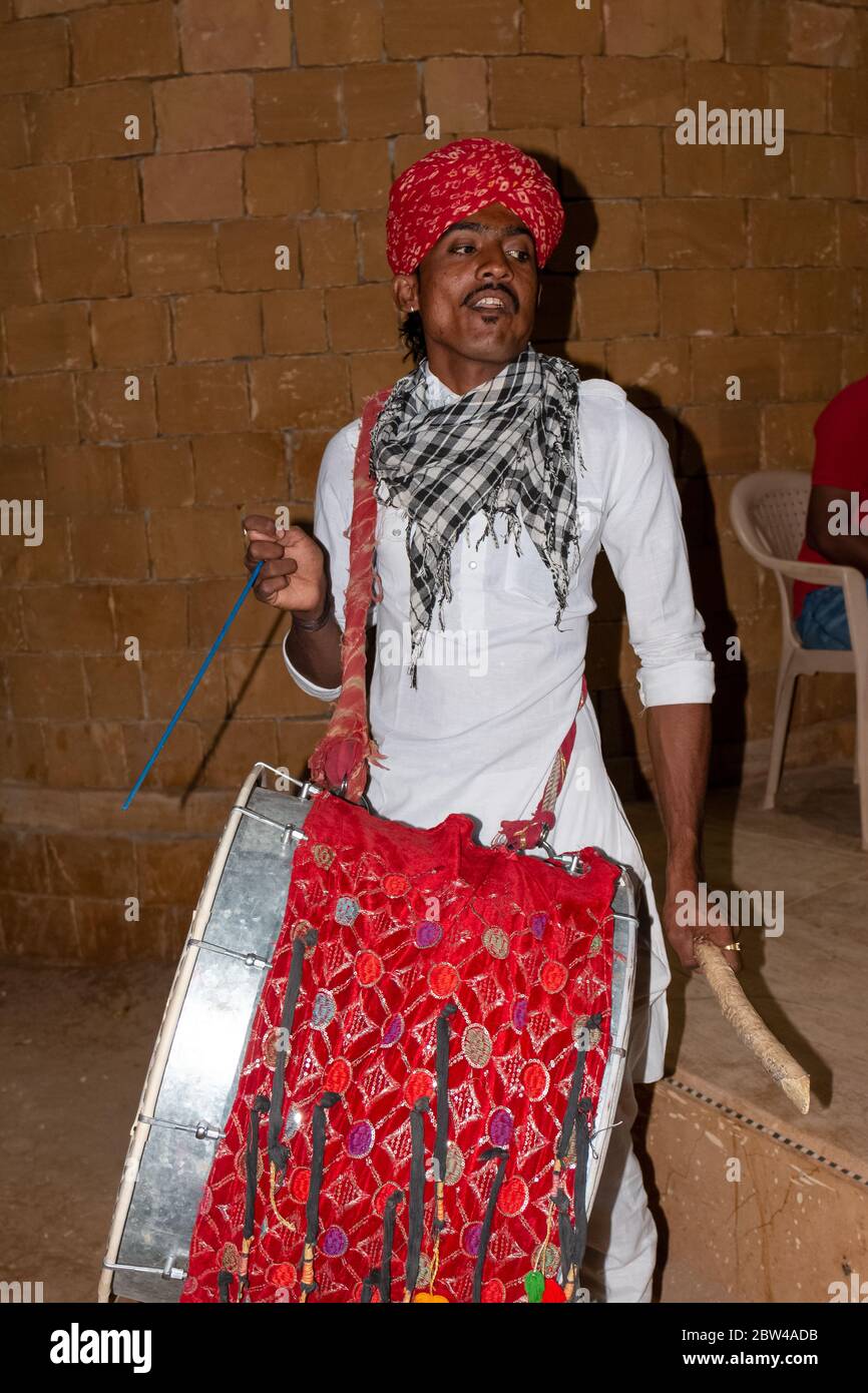 A Male artists performing with indian musical instruments in thar ...
