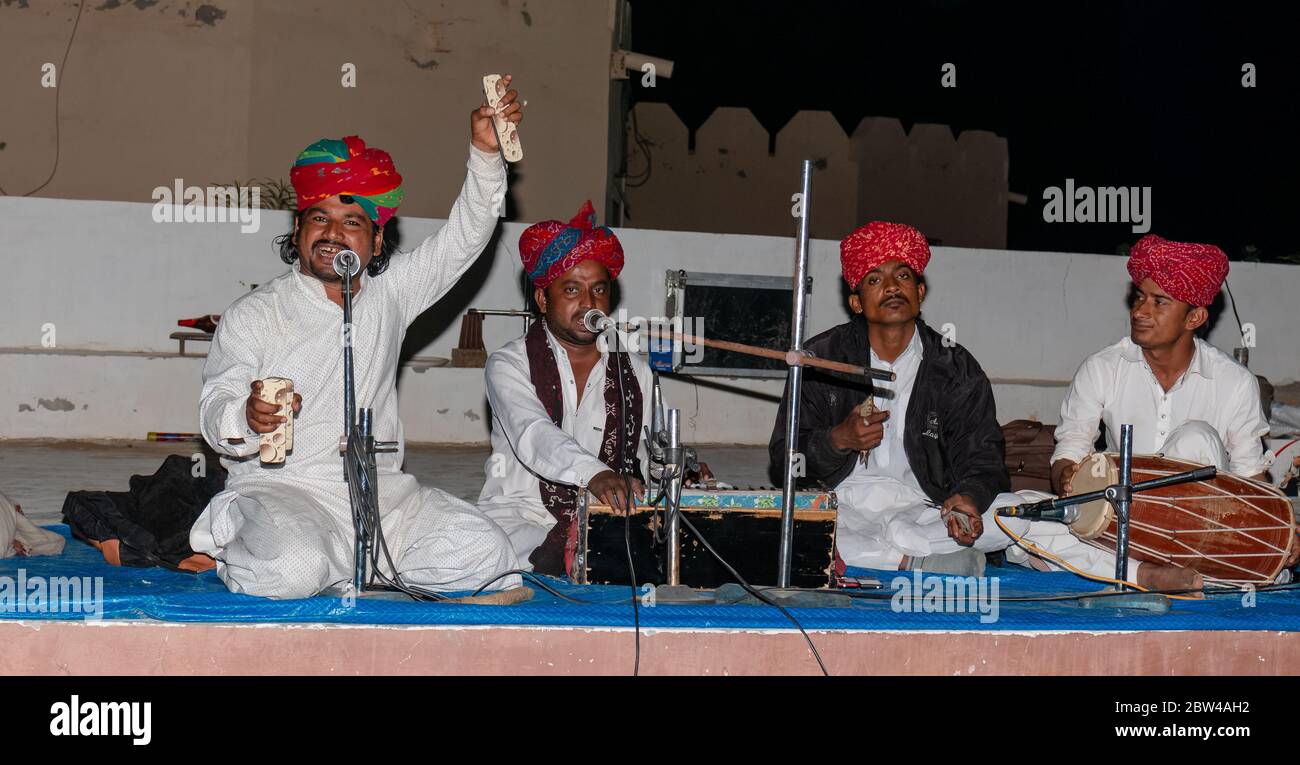 A Male artists performing with indian musical instruments in thar ...