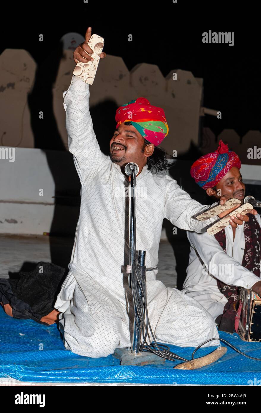 A Male artists performing with indian musical instruments in thar ...