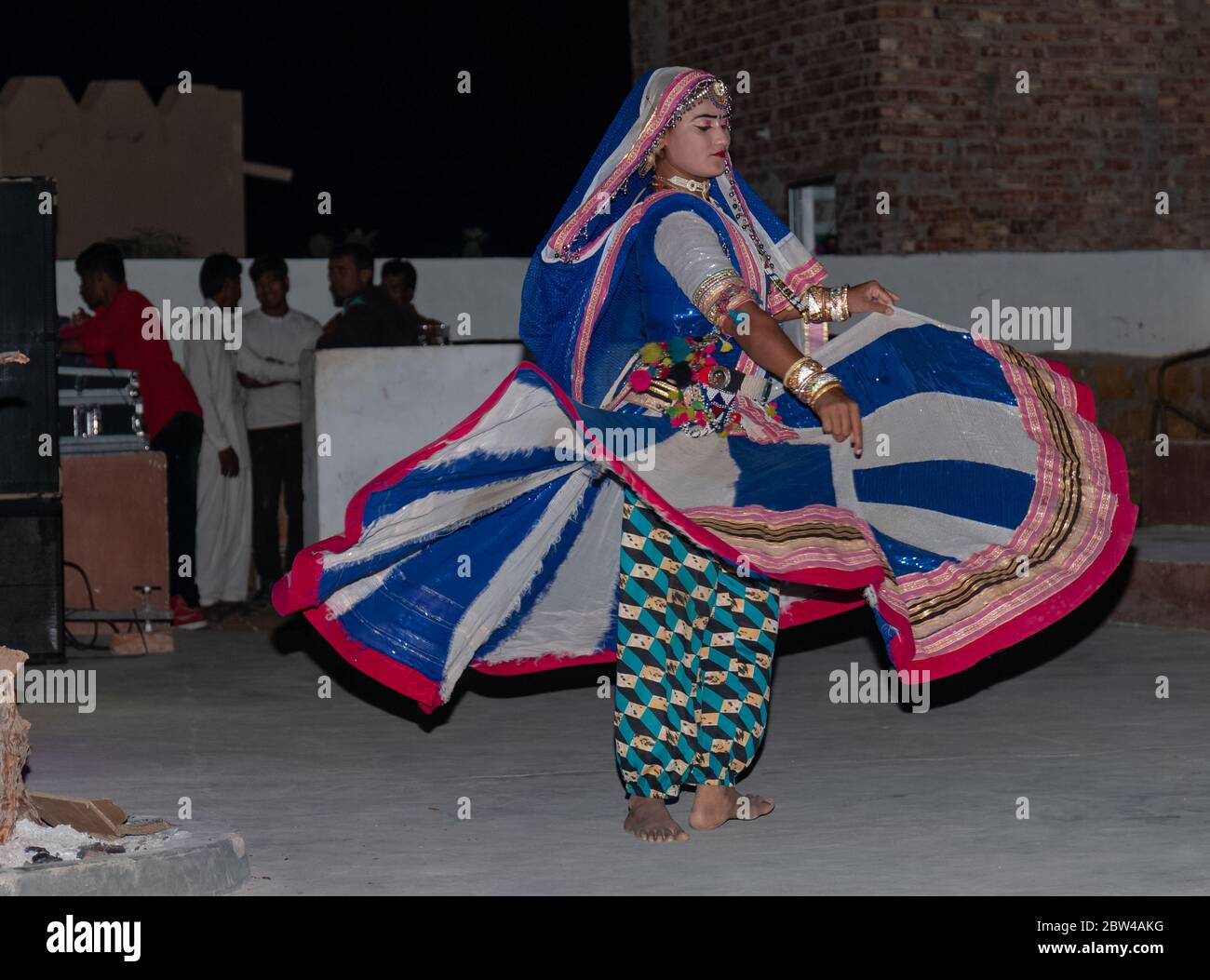Indian female artist performing Kalbelia folk dance with mud pots in ...