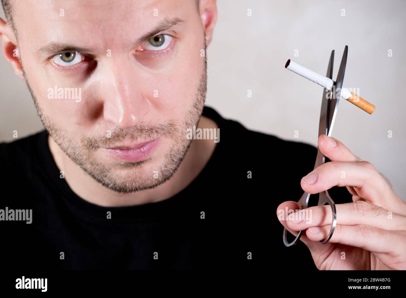 Man scissors cigarette hi-res stock photography and images - Alamy