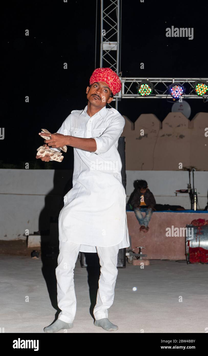 A Male artists performing with indian musical instruments in thar ...