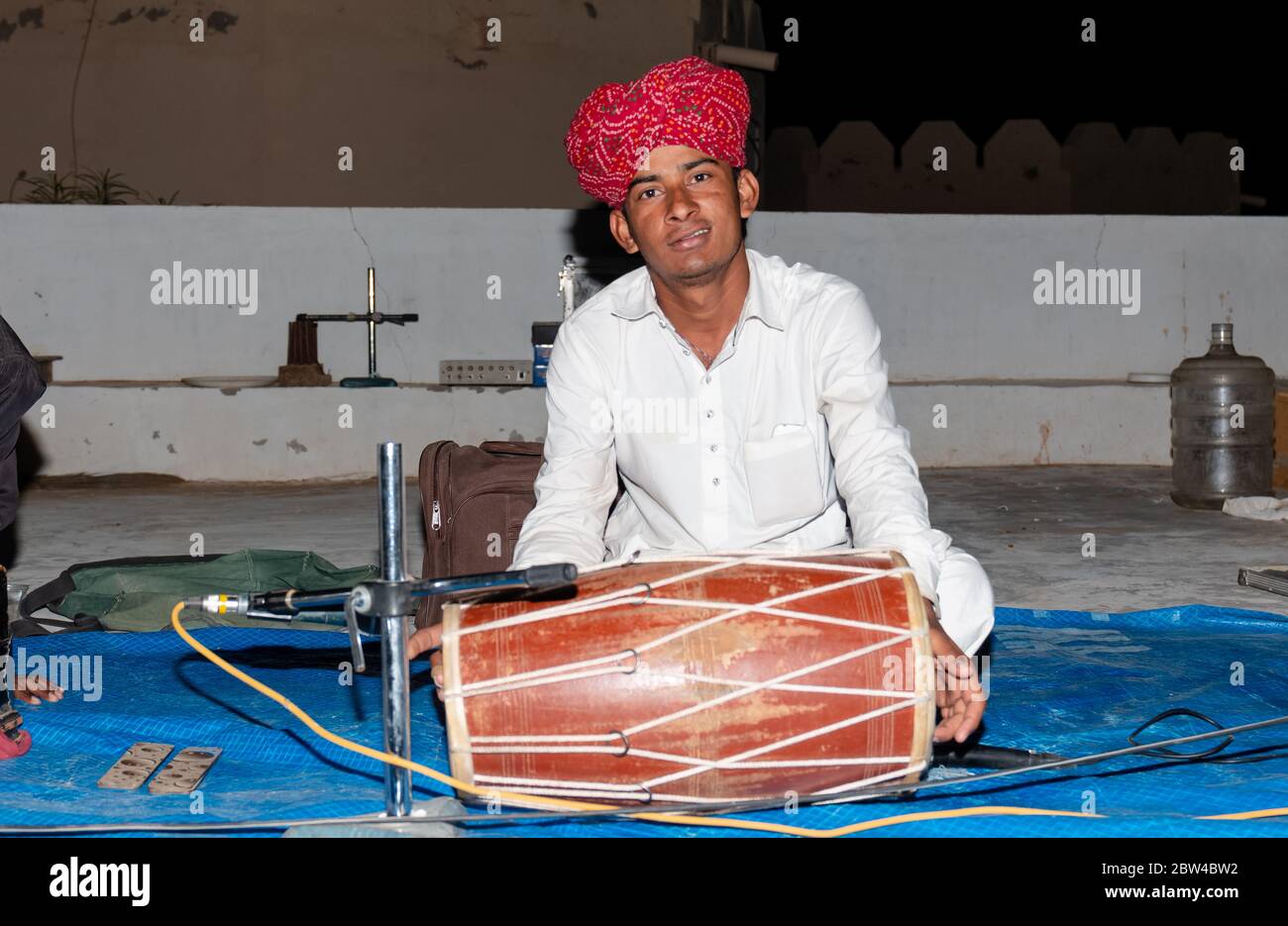 A Male artists performing with indian musical instruments in thar ...