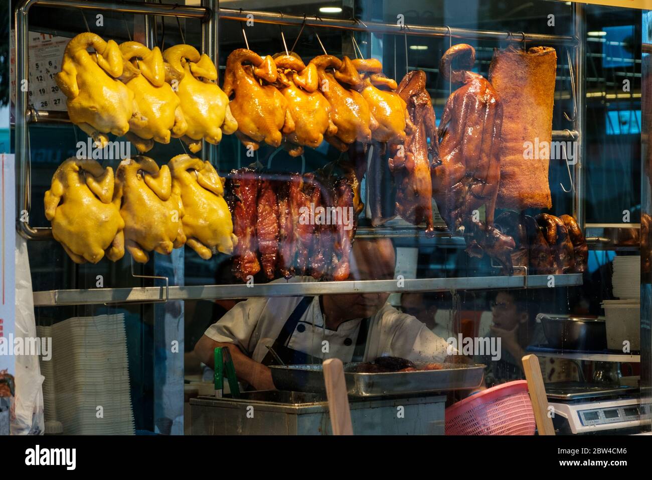 Roasted ducks hanging in window hi-res stock photography and images - Alamy