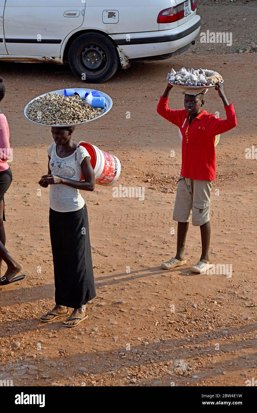 These nut and snack sellers skillfully balance their goods on their ...