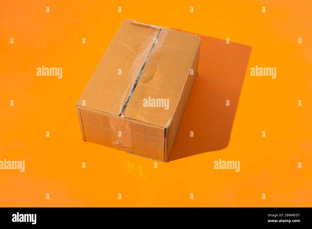 simple box delivery on color surface table, sending mail with things ...