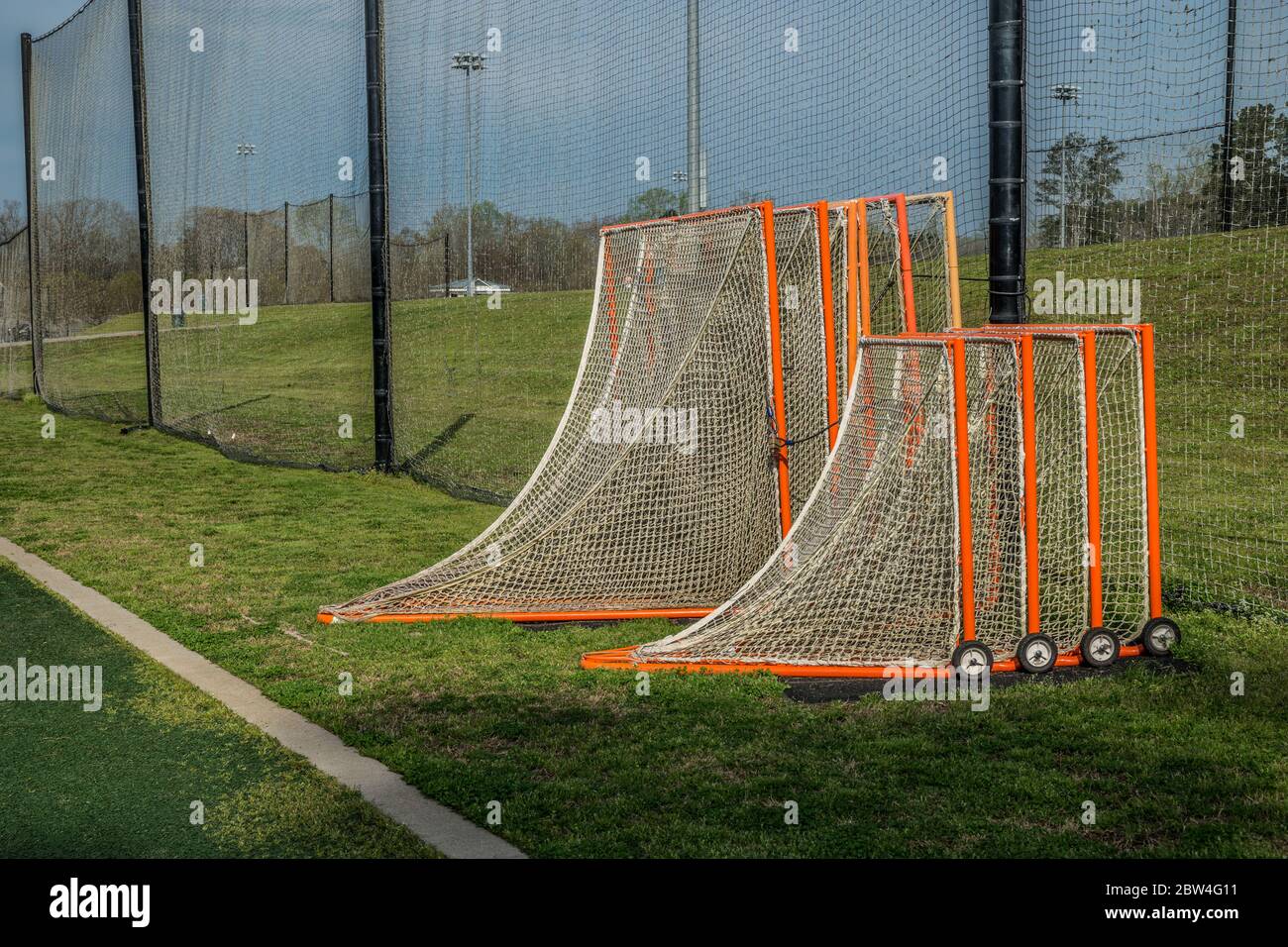 Stacked together different sizes of soccer goal nets set aside when not ...