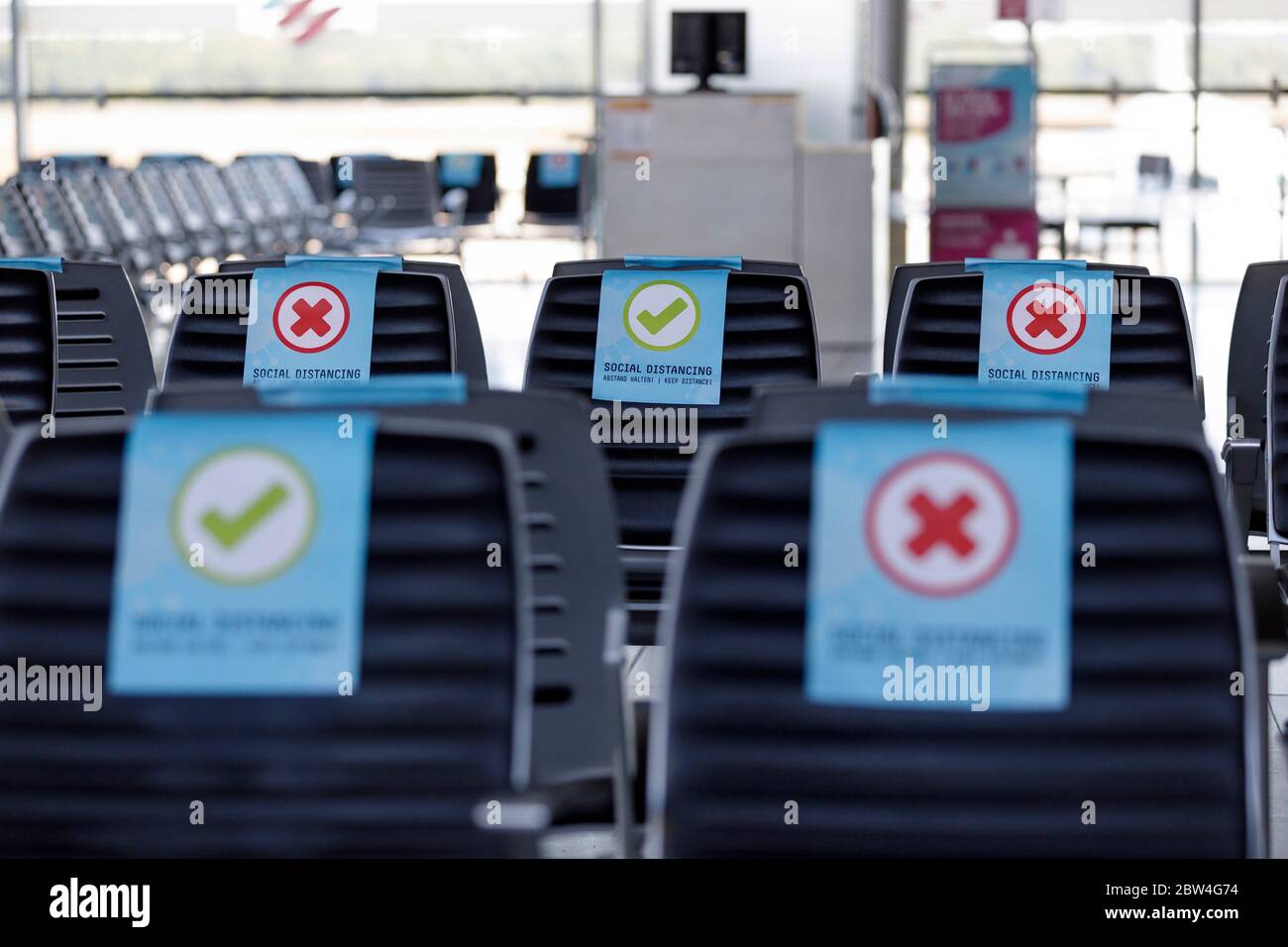 Waiting area with signs for social distancing at the presentation of ...