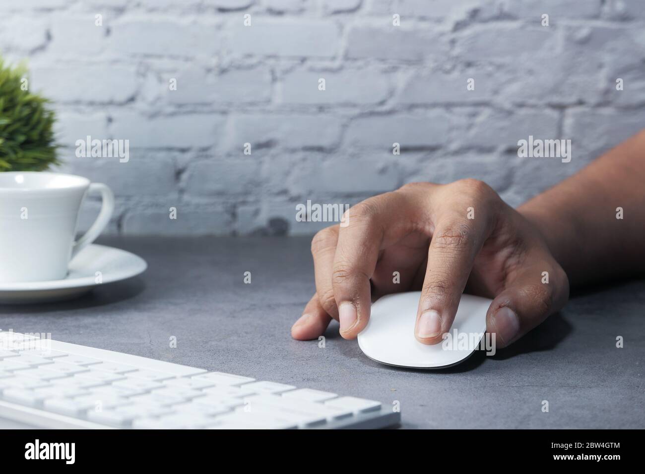 Man hand with computer mouse, Close up Stock Photo - Alamy