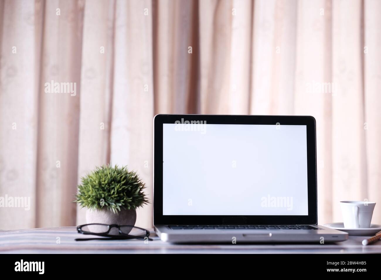 laptop with white screen on office table Stock Photo - Alamy
