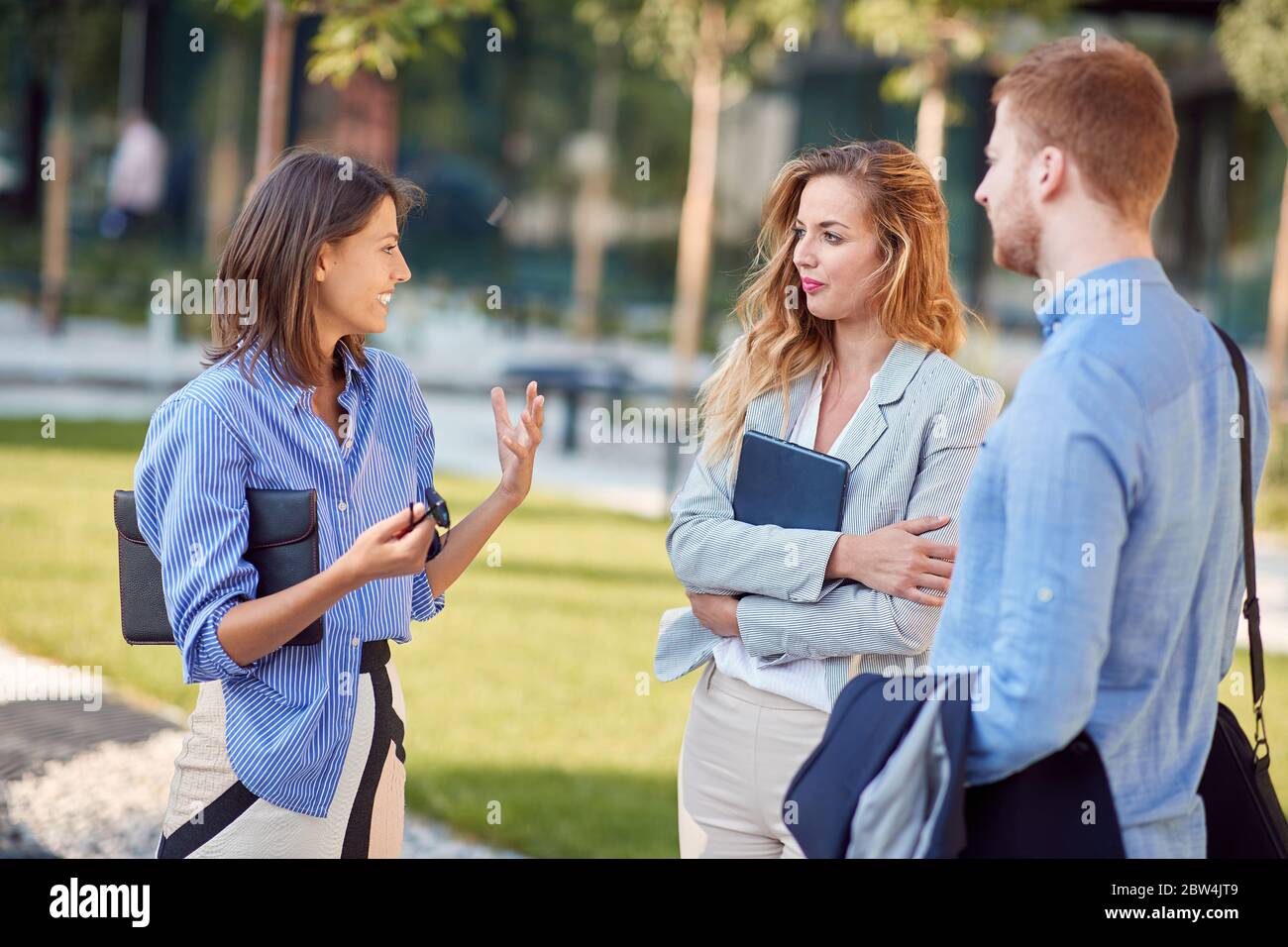 Male female chatting 30s street hi-res stock photography and images - Alamy