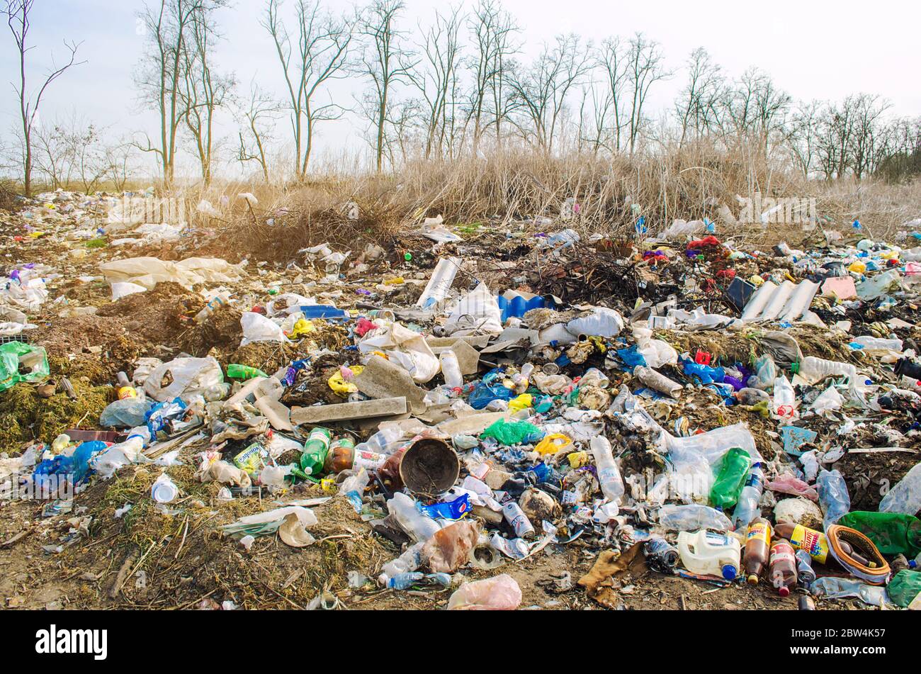 KHERSON, UKRAINE - MARCH 28, 2020: Heaps of garbage in the forest ...