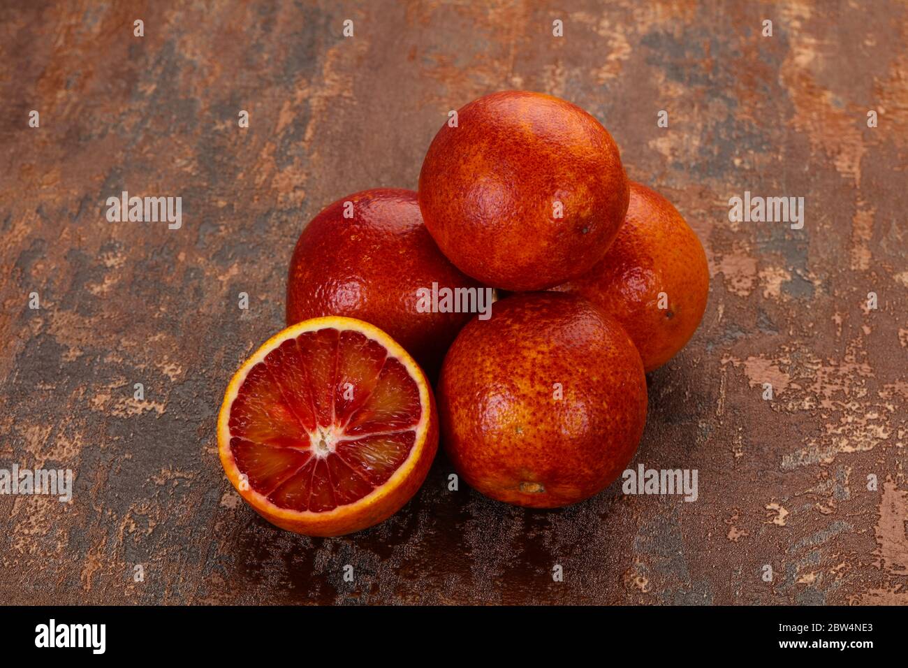 Sweet red orange heap over the table Stock Photo - Alamy