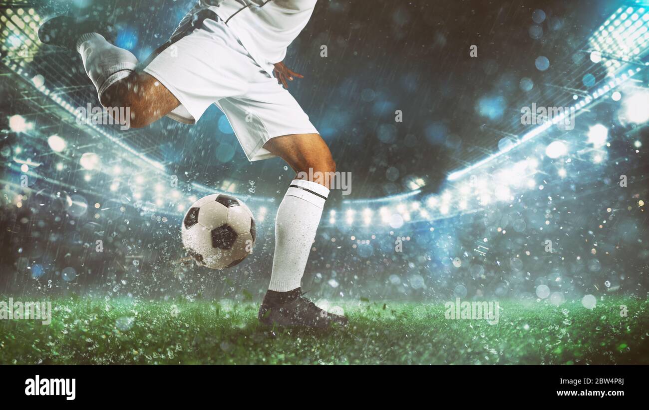 Soccer player kicking a ball hi-res stock photography and images - Alamy