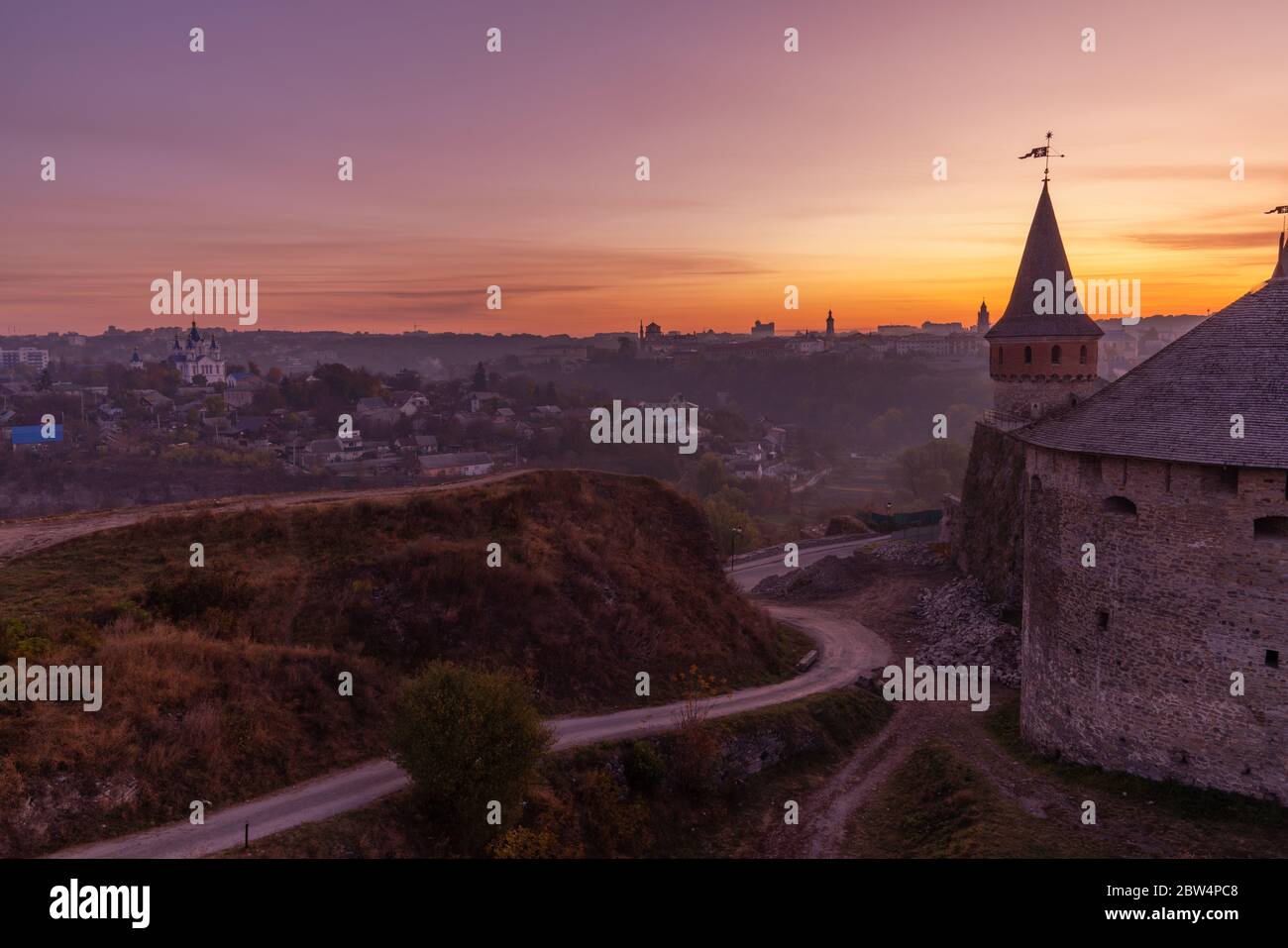 medieval castle or stronghold silhouette and beautiful sunset. Tourism ...