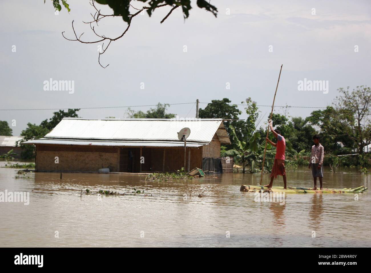 Two boys in river floods hi-res stock photography and images - Alamy