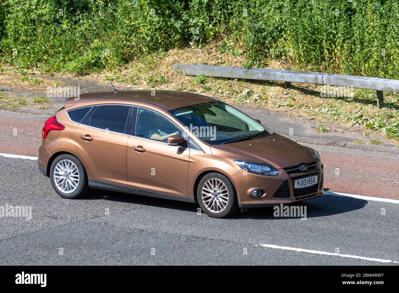2013 brown Ford Focus Zetec Turbo; Vehicular traffic moving vehicles ...