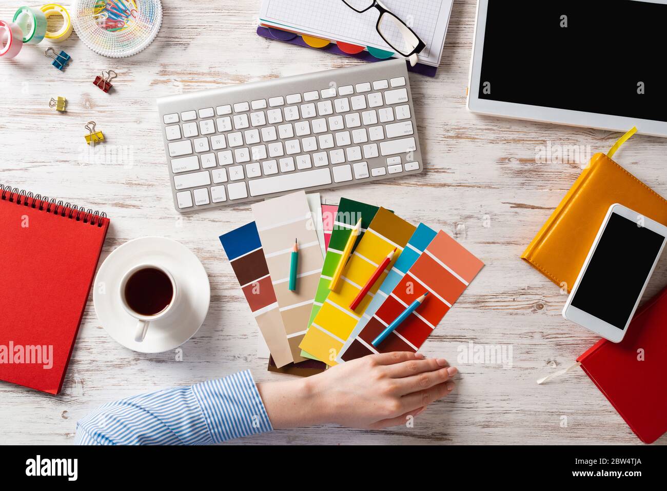 Web designer choosing colors from swatches Stock Photo - Alamy