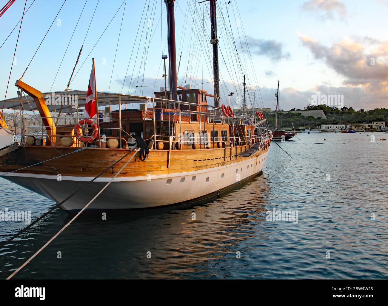 A two masted sailing ship lies at anchor in the harbour at Sliema in ...