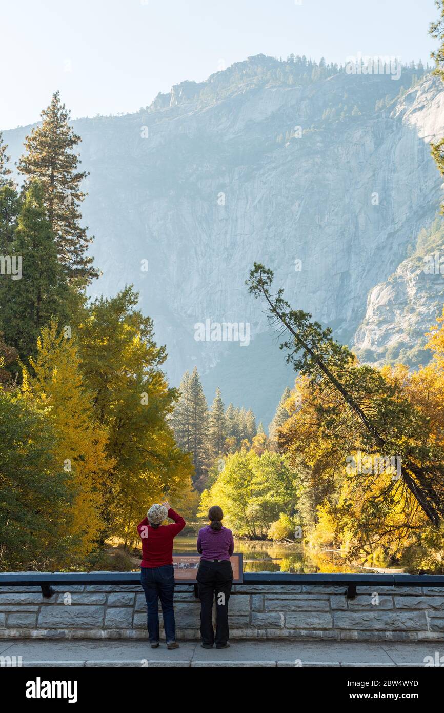 Two tourists observe and photograph the landscape from the Sentinel ...